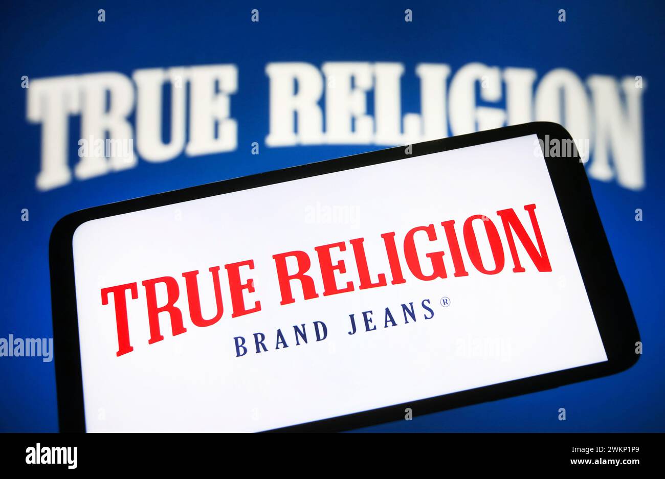 In this photo illustration, True Religion Brand Jeans logo is seen on a ...