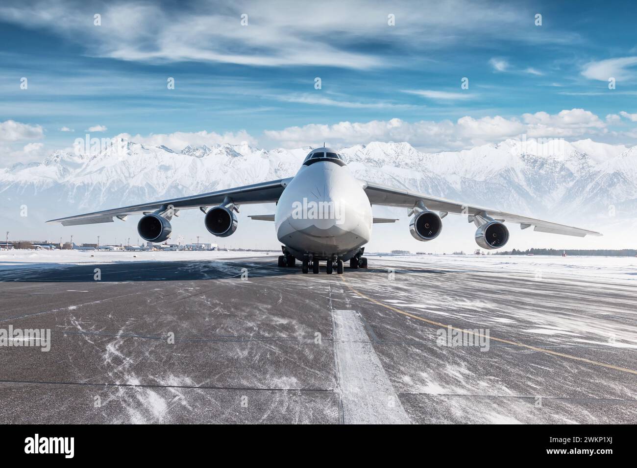 Front view of the white wide body transport cargo aircraft at winter ...