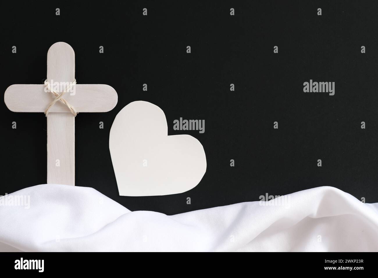 White wooden cross and fabric as symbol of heaven. Funeral and burial ...