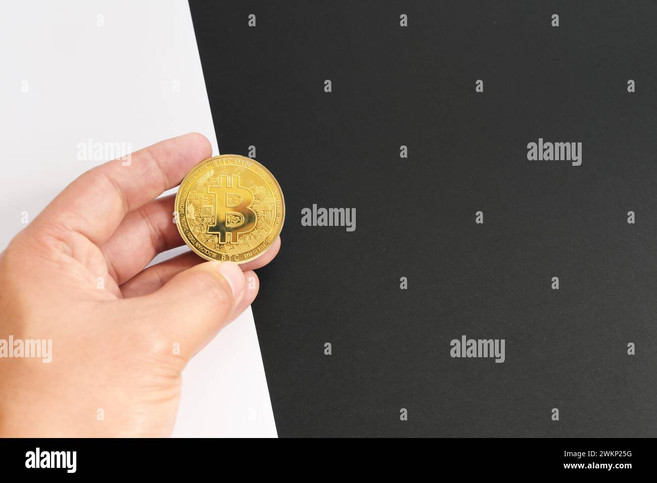Bitcoin halving concept in cryptocurrency. Human hand holding coin in ...