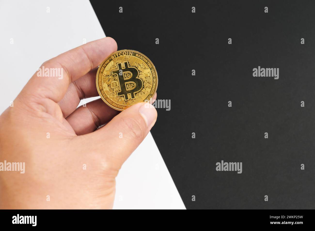 Bitcoin halving concept in cryptocurrency. Human hand holding coin in ...