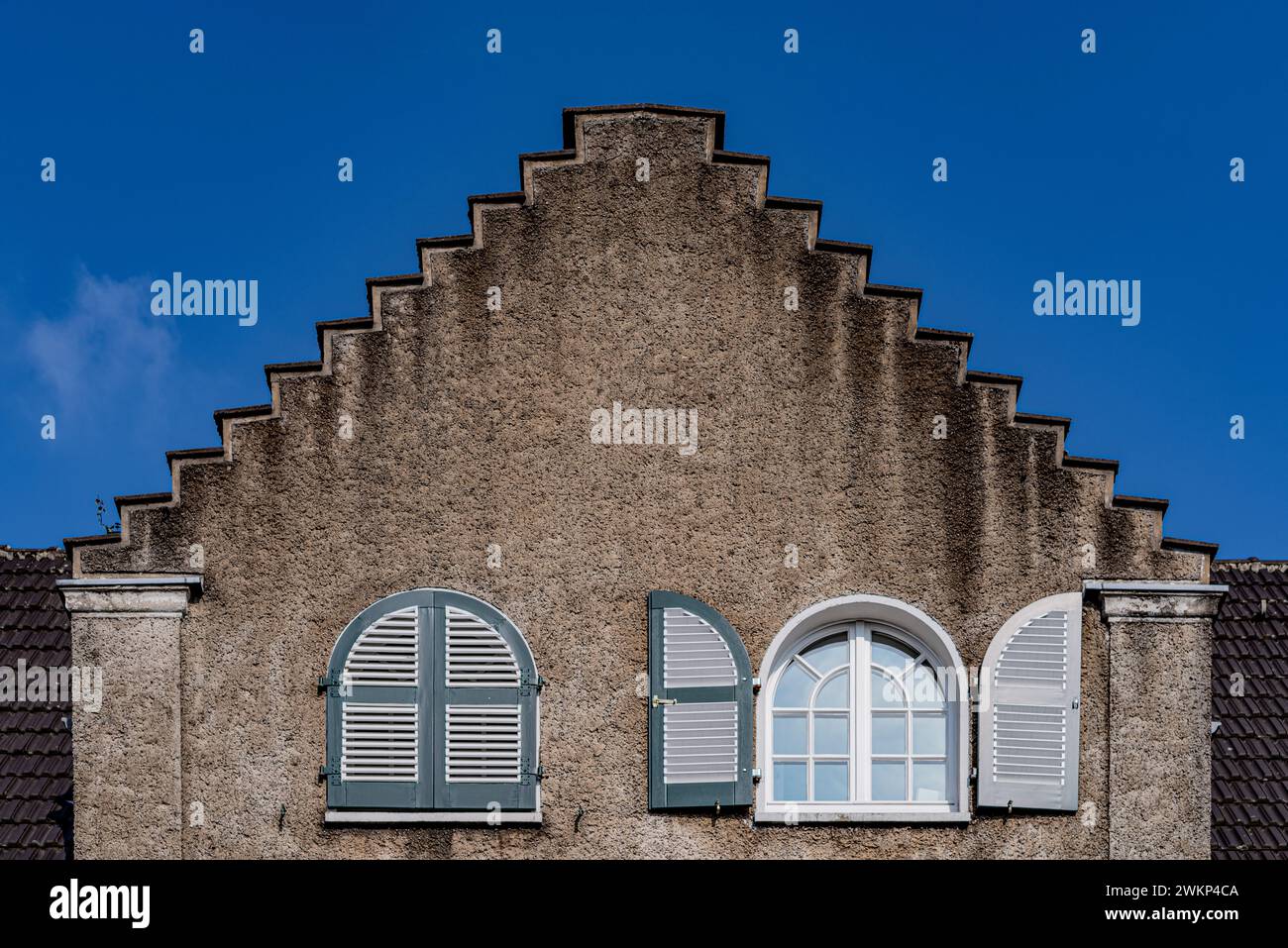 Ancient brick structure with two arched windows on the upper level ...