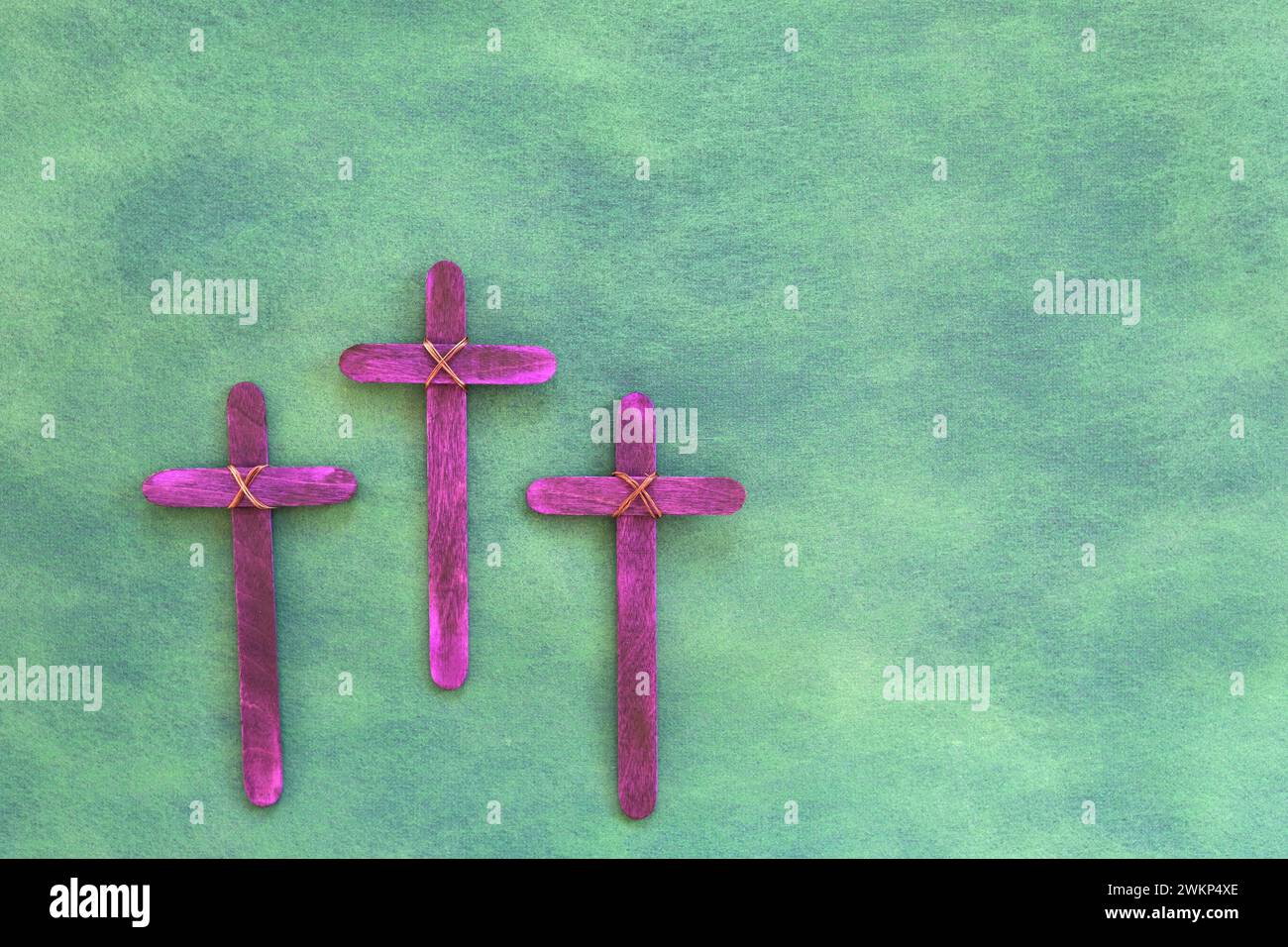 Three purple wooden cross in green background. Holy week and lent ...