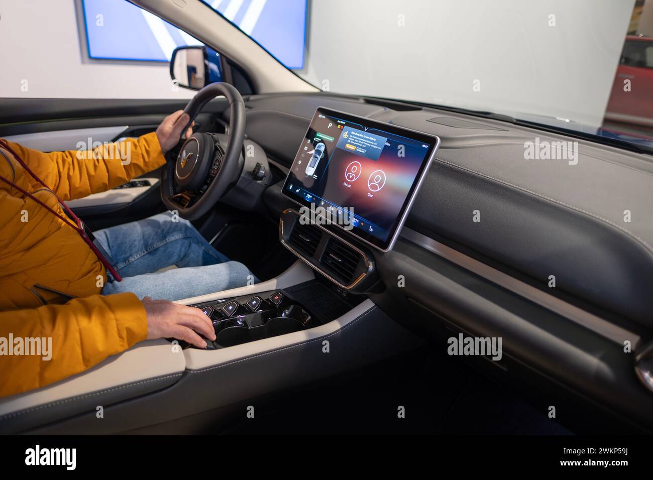 male hands on steering wheel, Interior, cockpit of Vinfast vf 8 ...