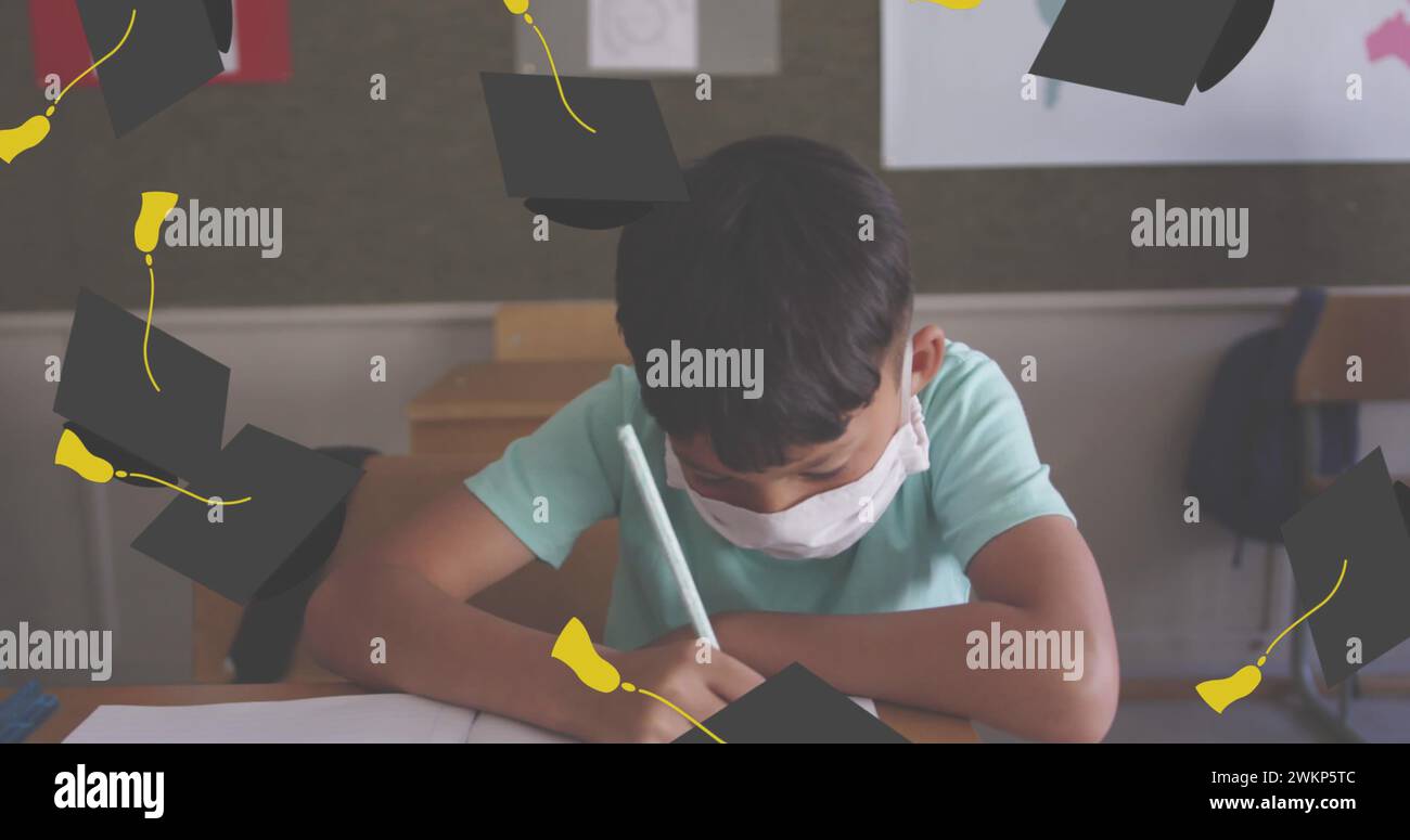 Image of falling academic cap over boy wearing face mask sitting in ...