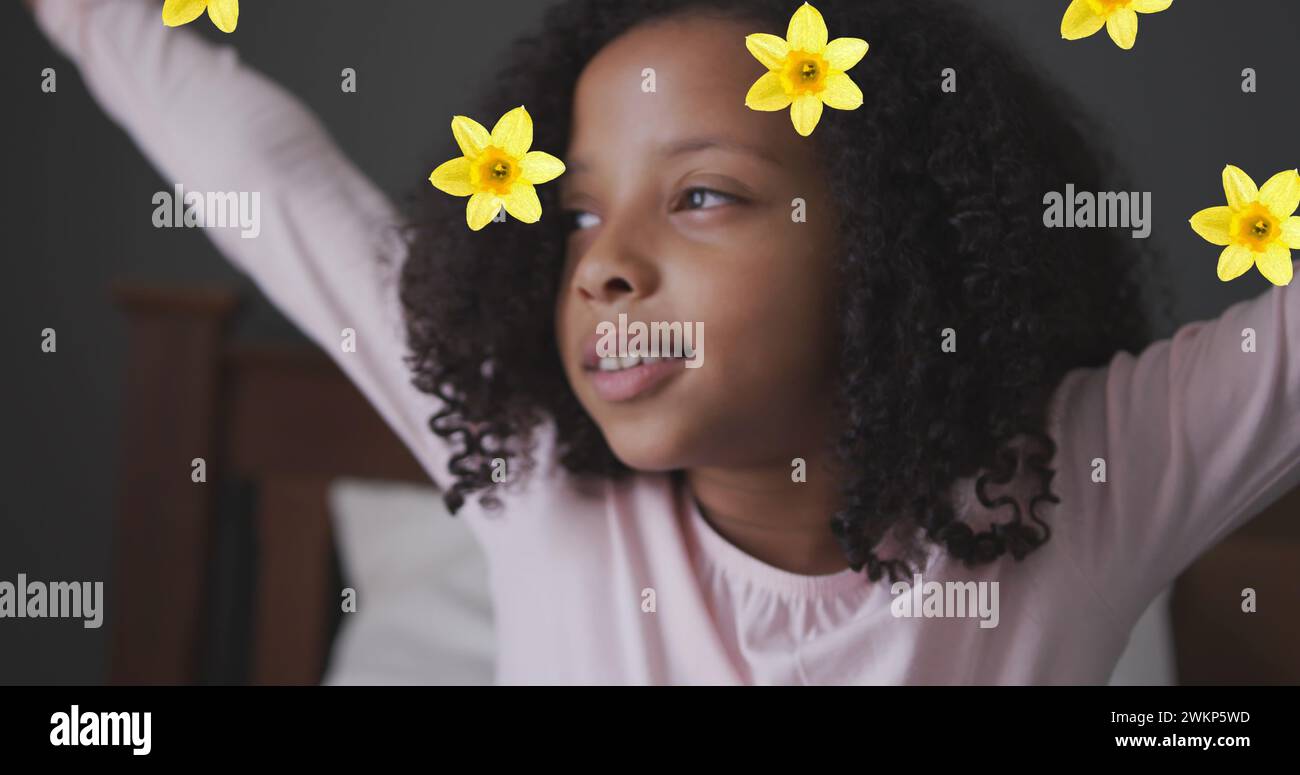 Image of flowers over african american girl waking up Stock Photo - Alamy