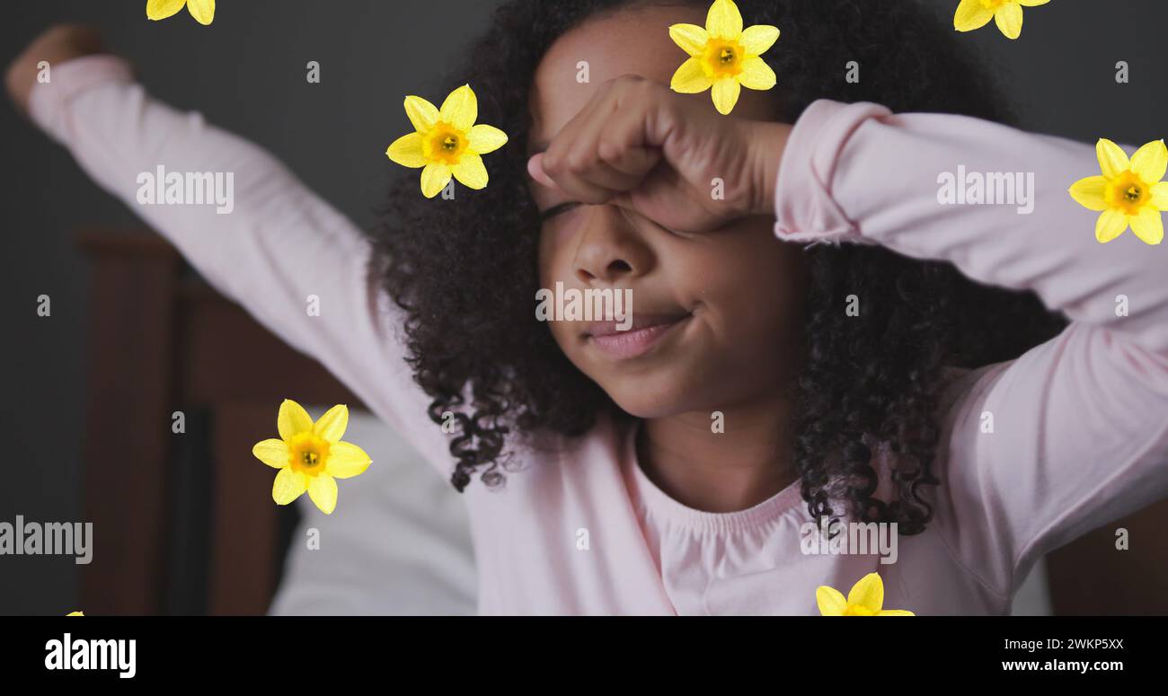 Image of flowers over african american girl waking up Stock Photo - Alamy