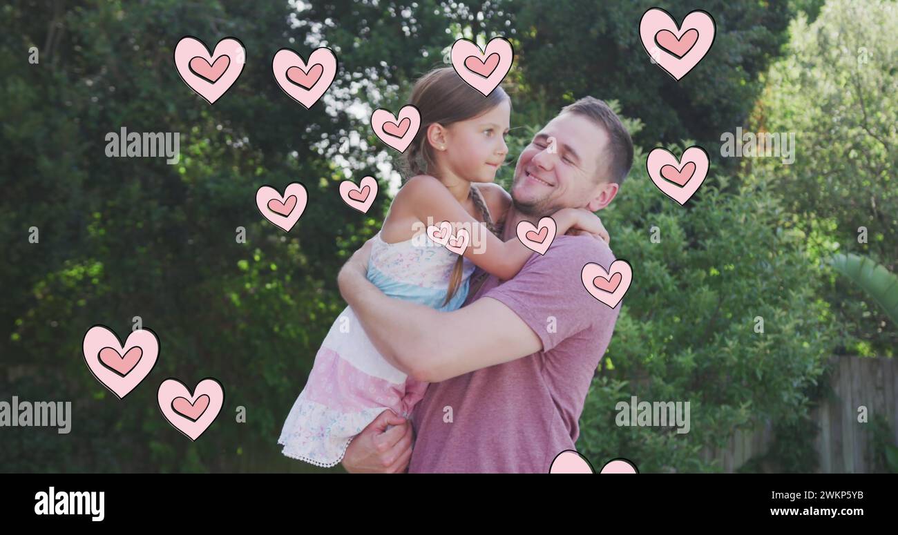 Image of hearts over caucasian father hugging his daughter in garden ...