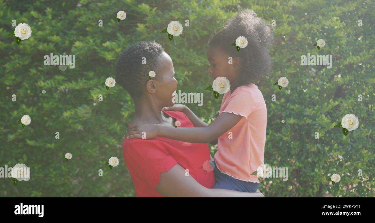 Image of roses over happy african american mother and daughter hugging in garden Stock Photo - Alamy