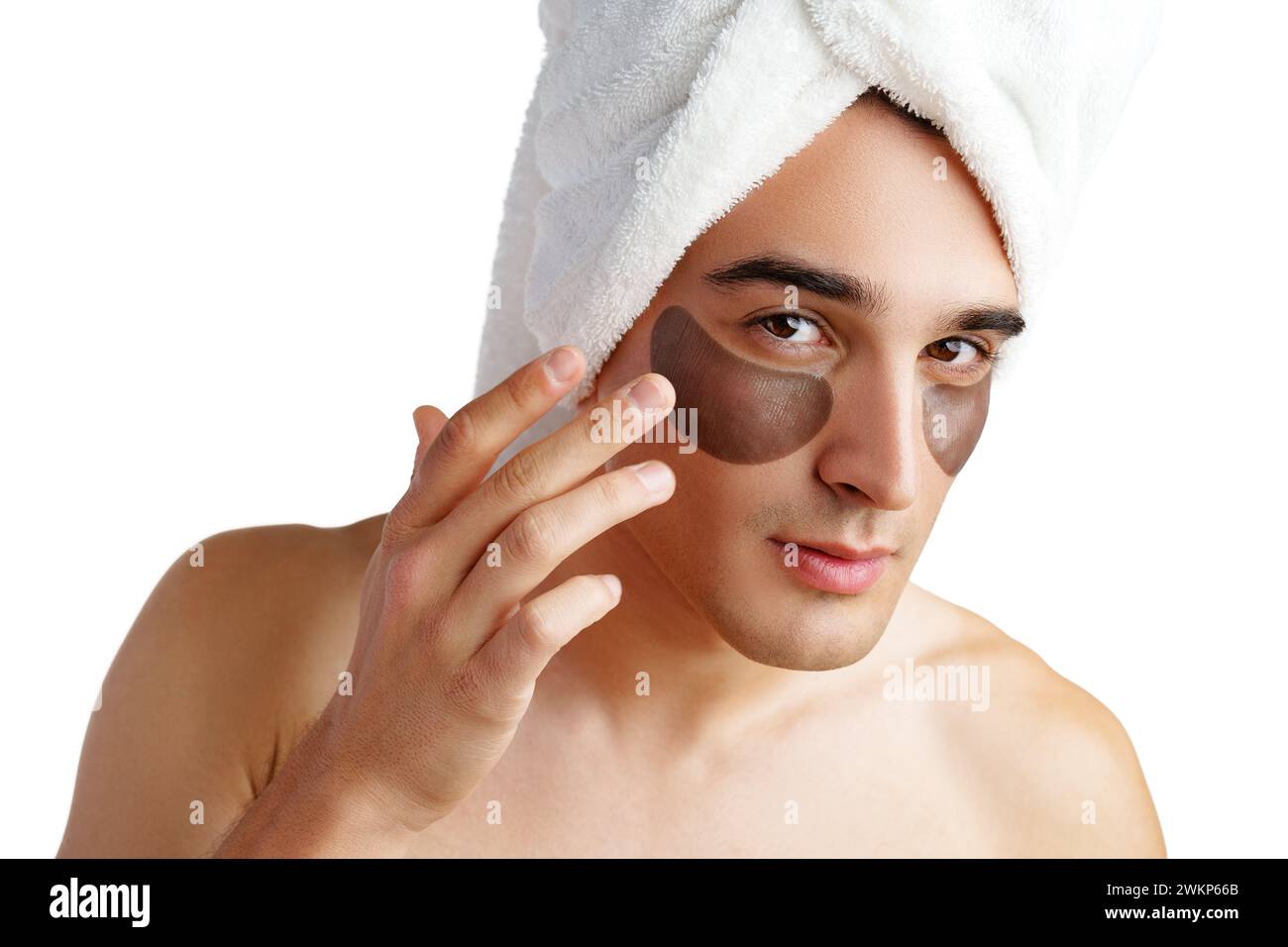 Portrait of attractive young male model with eye patches on white ...