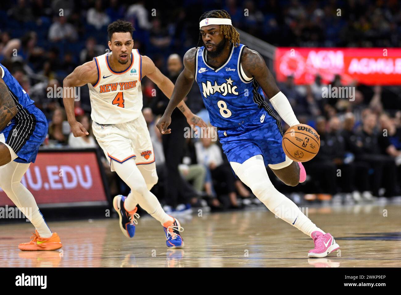 Orlando Magic guard Kevon Harris (8) drives past New York Knicks guard ...