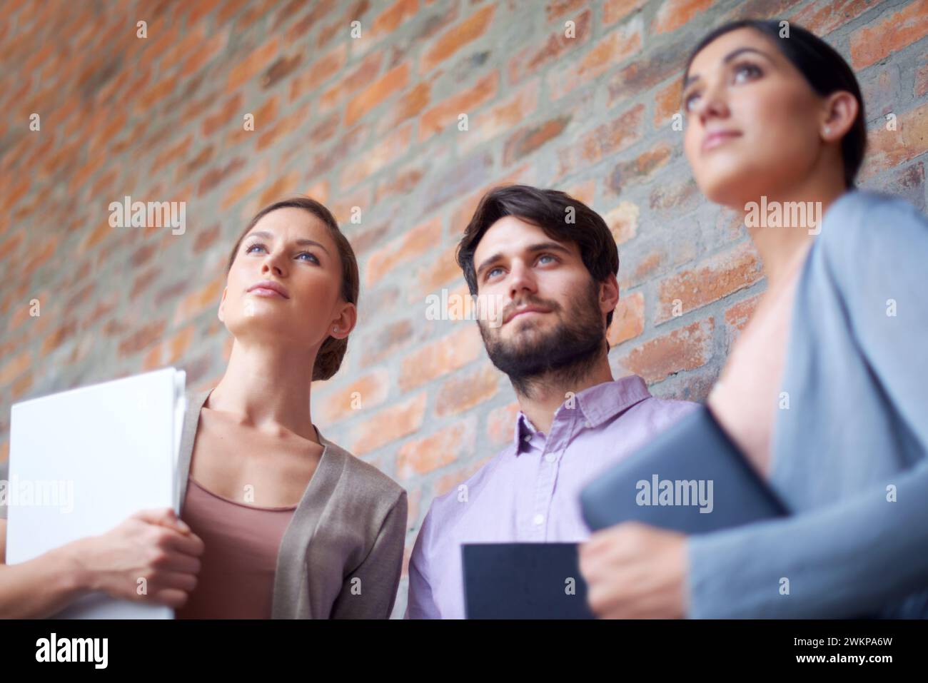 Business, colleagues and together while thinking of ideas for work ...