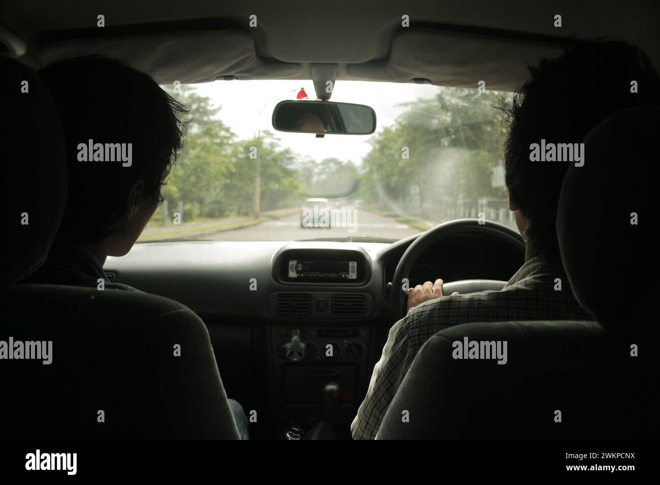 Two man drive in car front view hi-res stock photography and images - Alamy