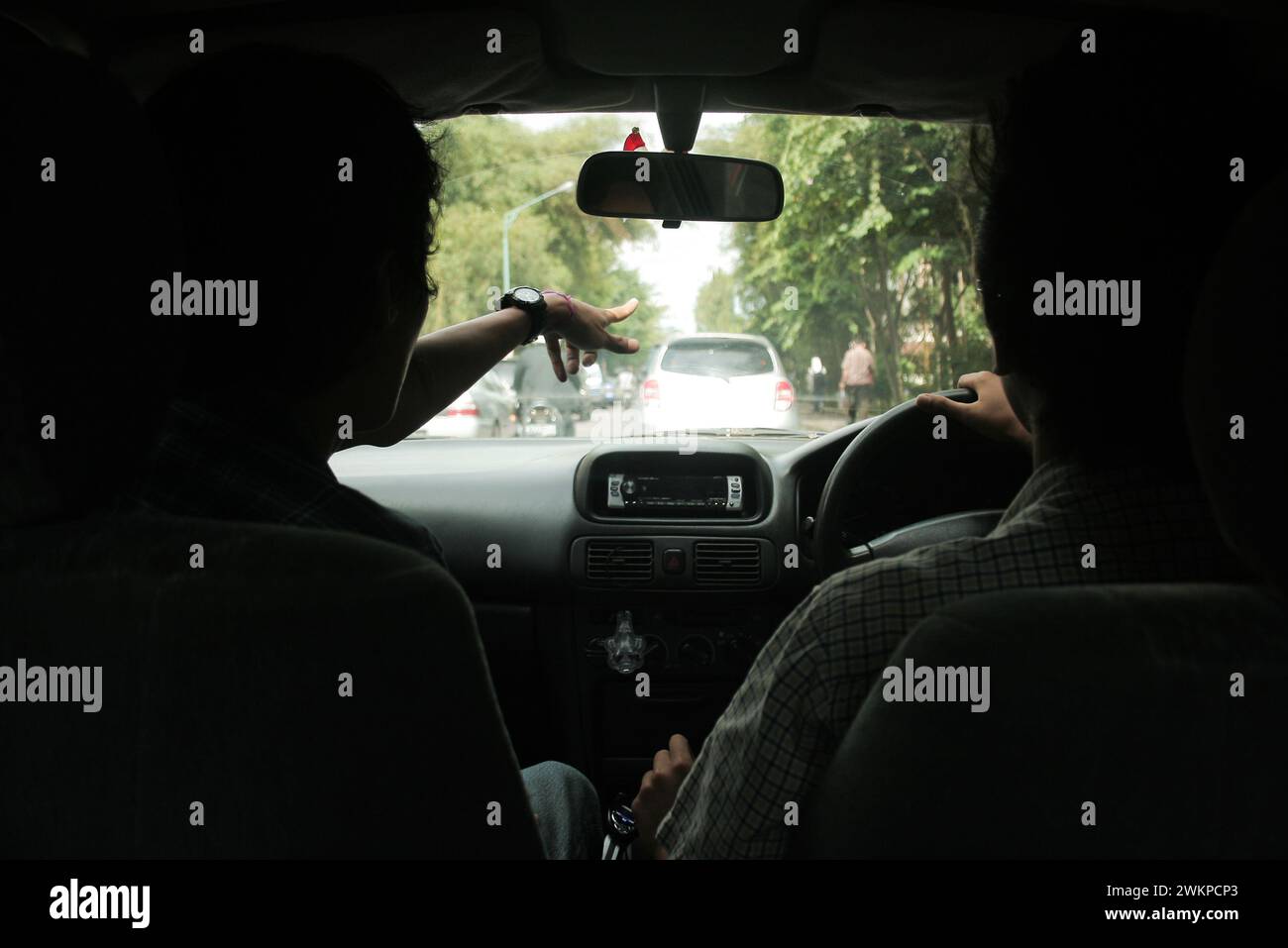 Man drive with his friend front view hi-res stock photography and ...