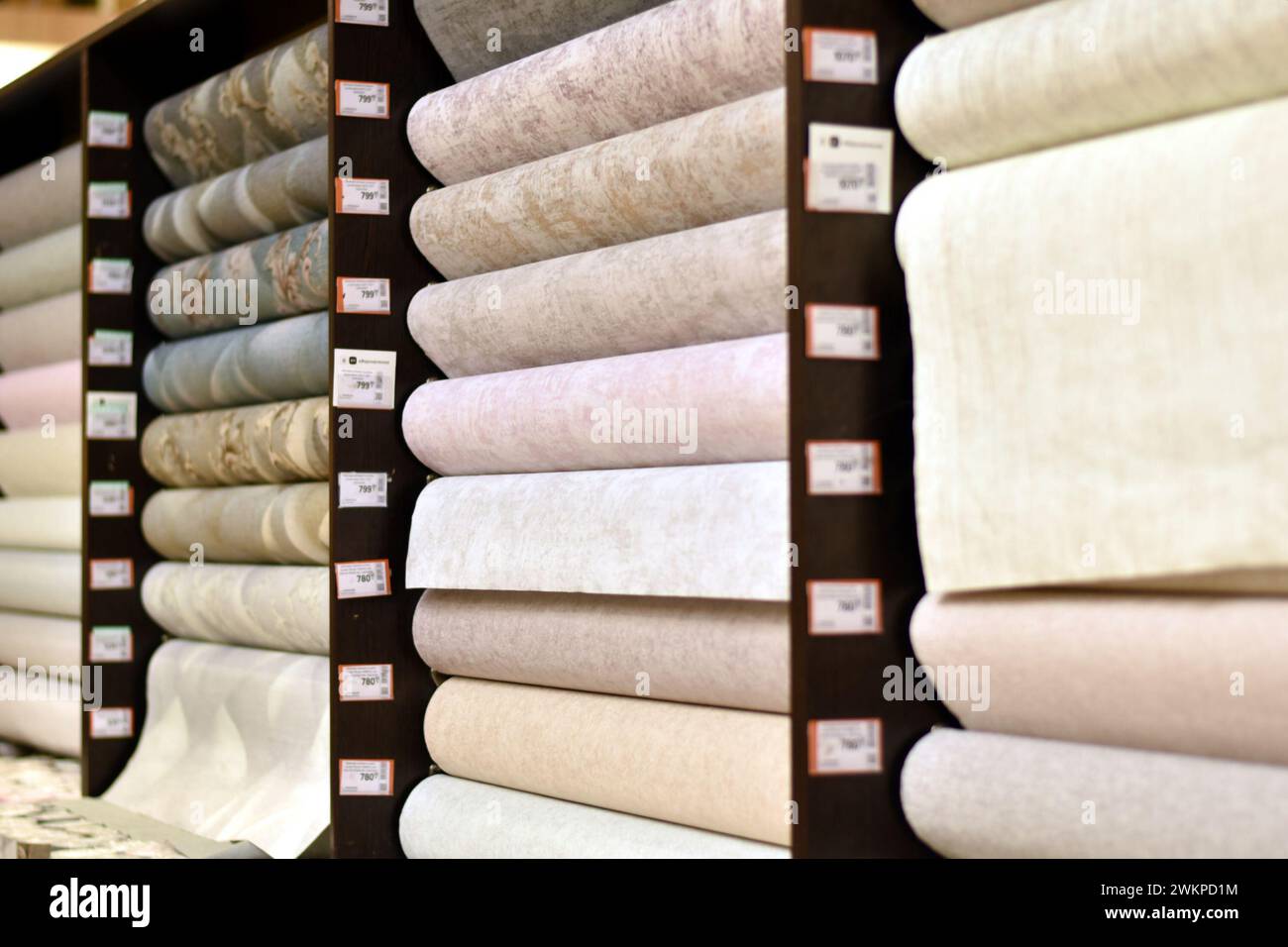 Showcase in a store with rolls of paper wallpaper Stock Photo - Alamy