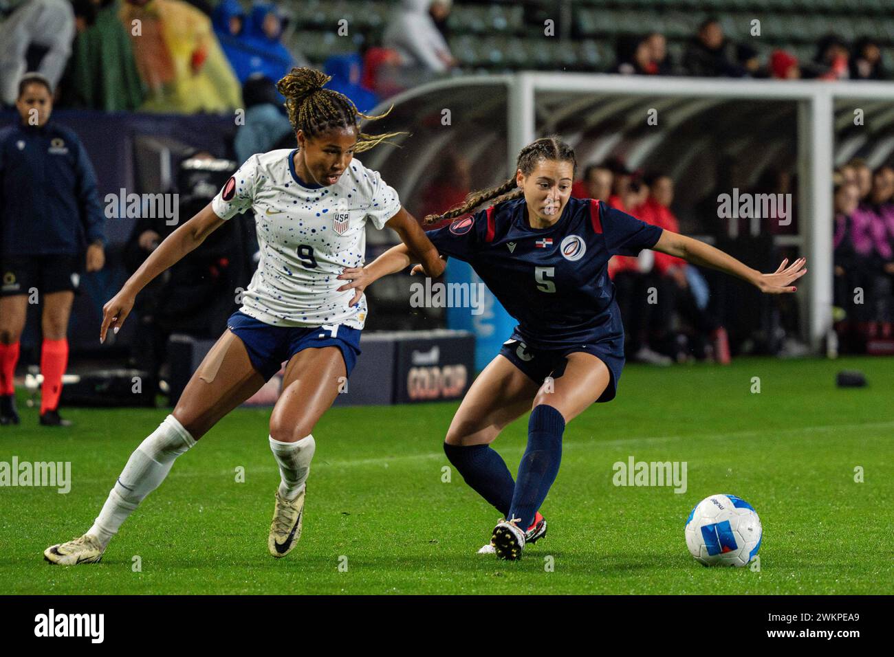 United States forward Midge Purce (9) is defended by Dominican Republic ...