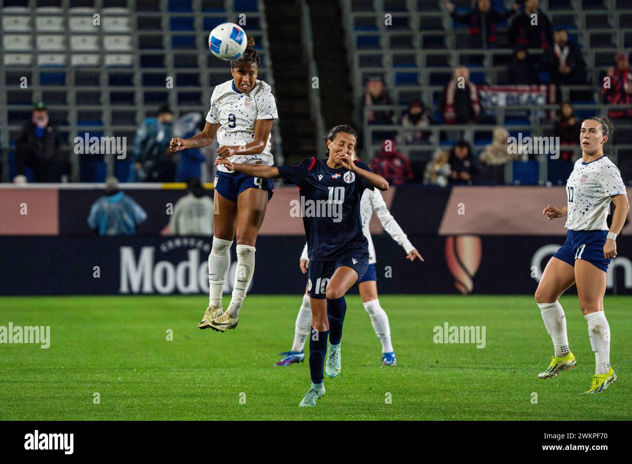 United States forward Midge Purce (9) wins a header against Dominican ...