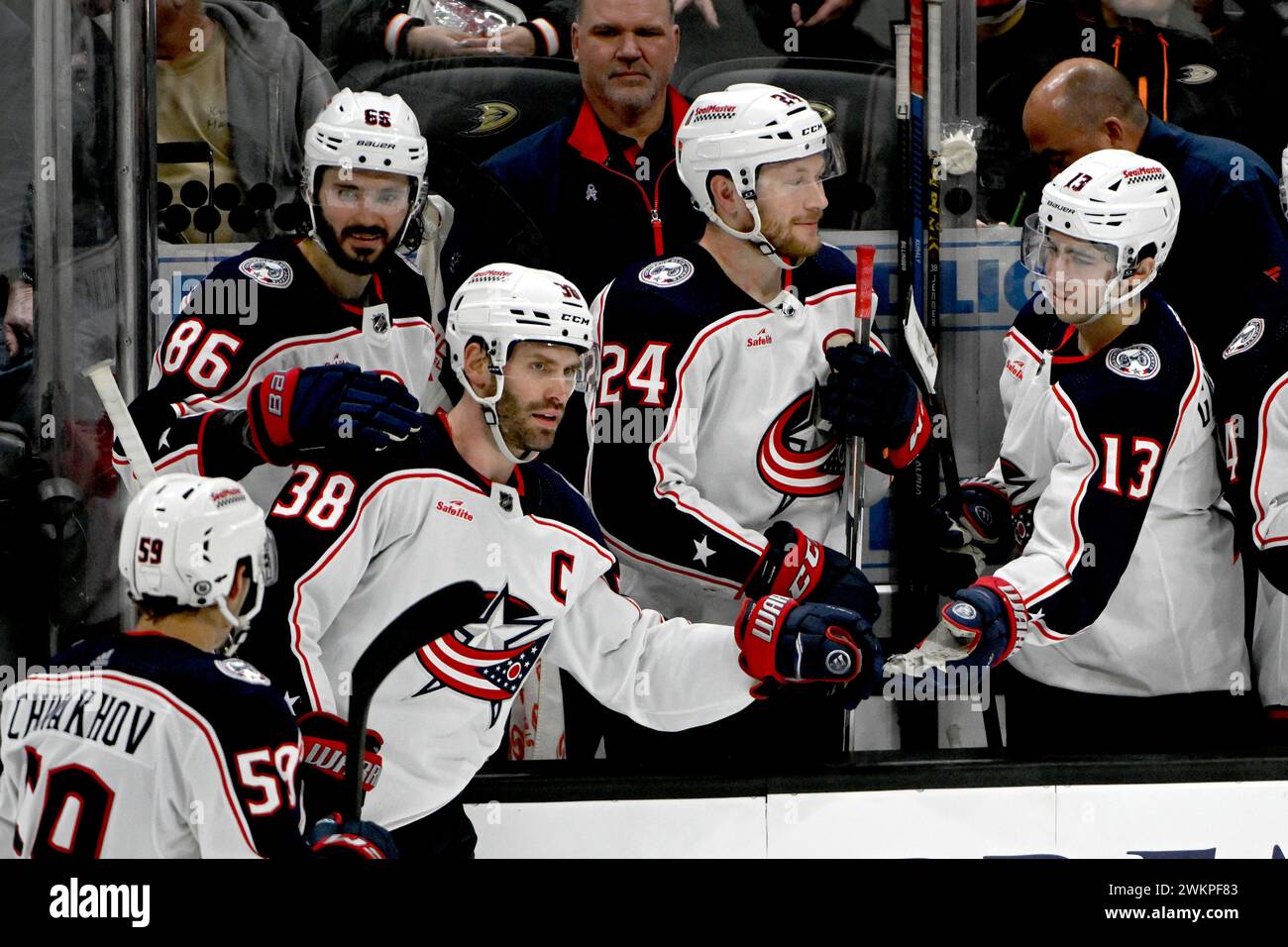 Columbus Blue Jackets center Boone Jenner (38) gets congratulations ...
