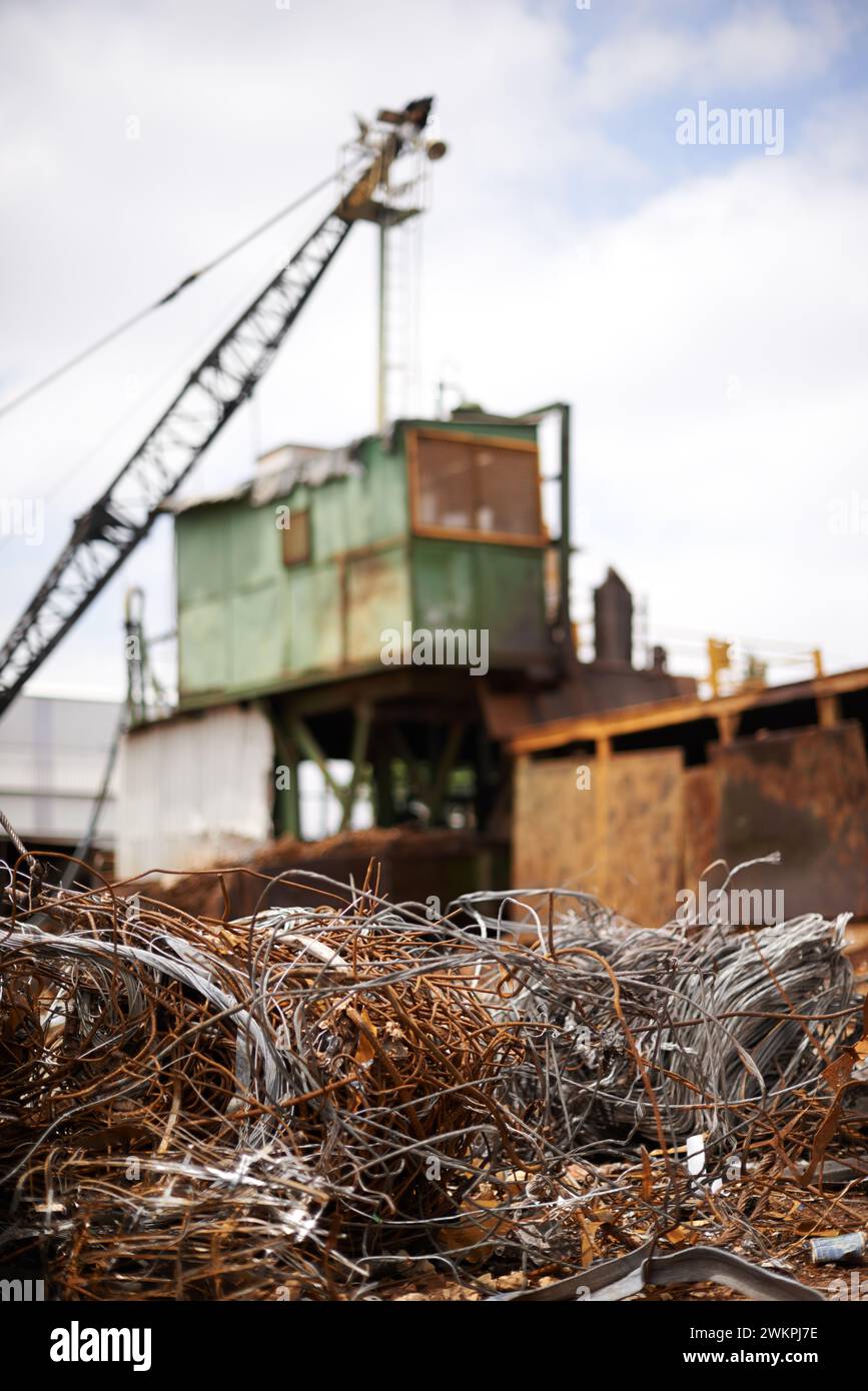 Crane, machine and junkyard for moving metal with sustainability ...