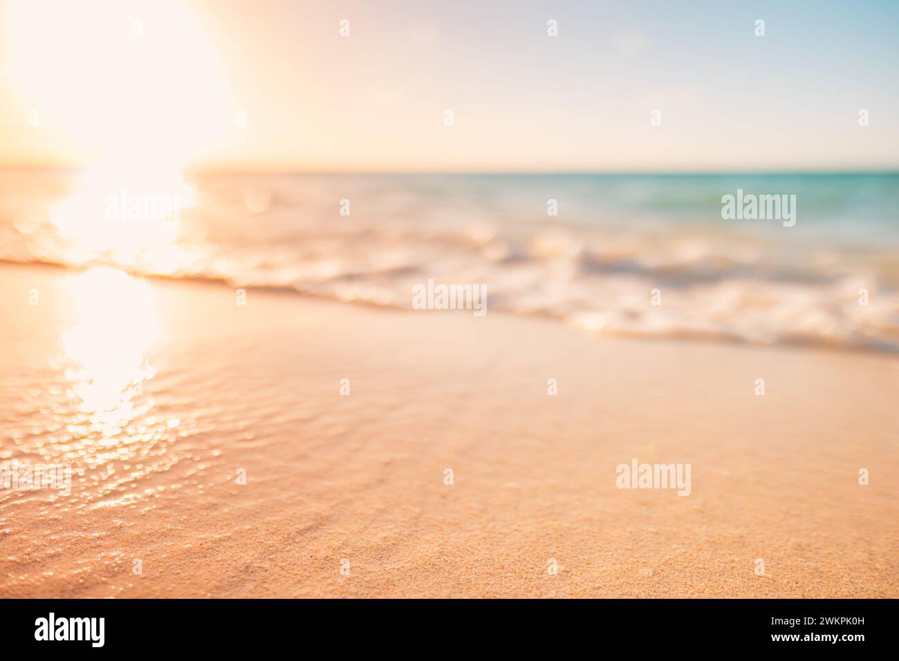 Fantastic closeup view of calm sea water waves with orange sunrise ...