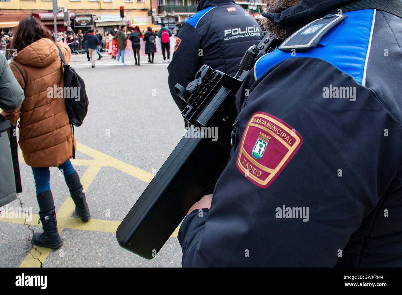 Police officer of the city of Madrid carrying a weapon to shoot down ...