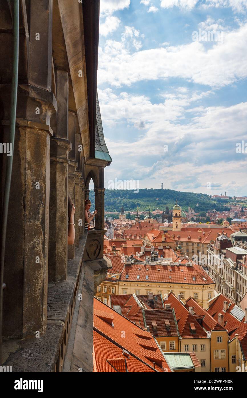 The tourists at the town hall and the rooftop of the historical ...