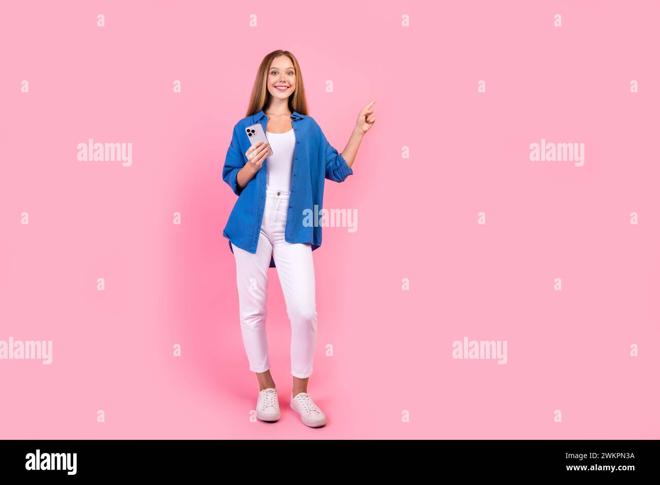 Full length photo of shiny excited girl wear blue shirt texting ...