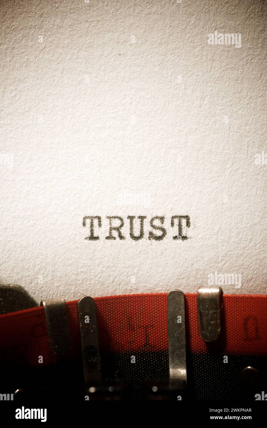 Trust word written with a typewriter Stock Photo - Alamy
