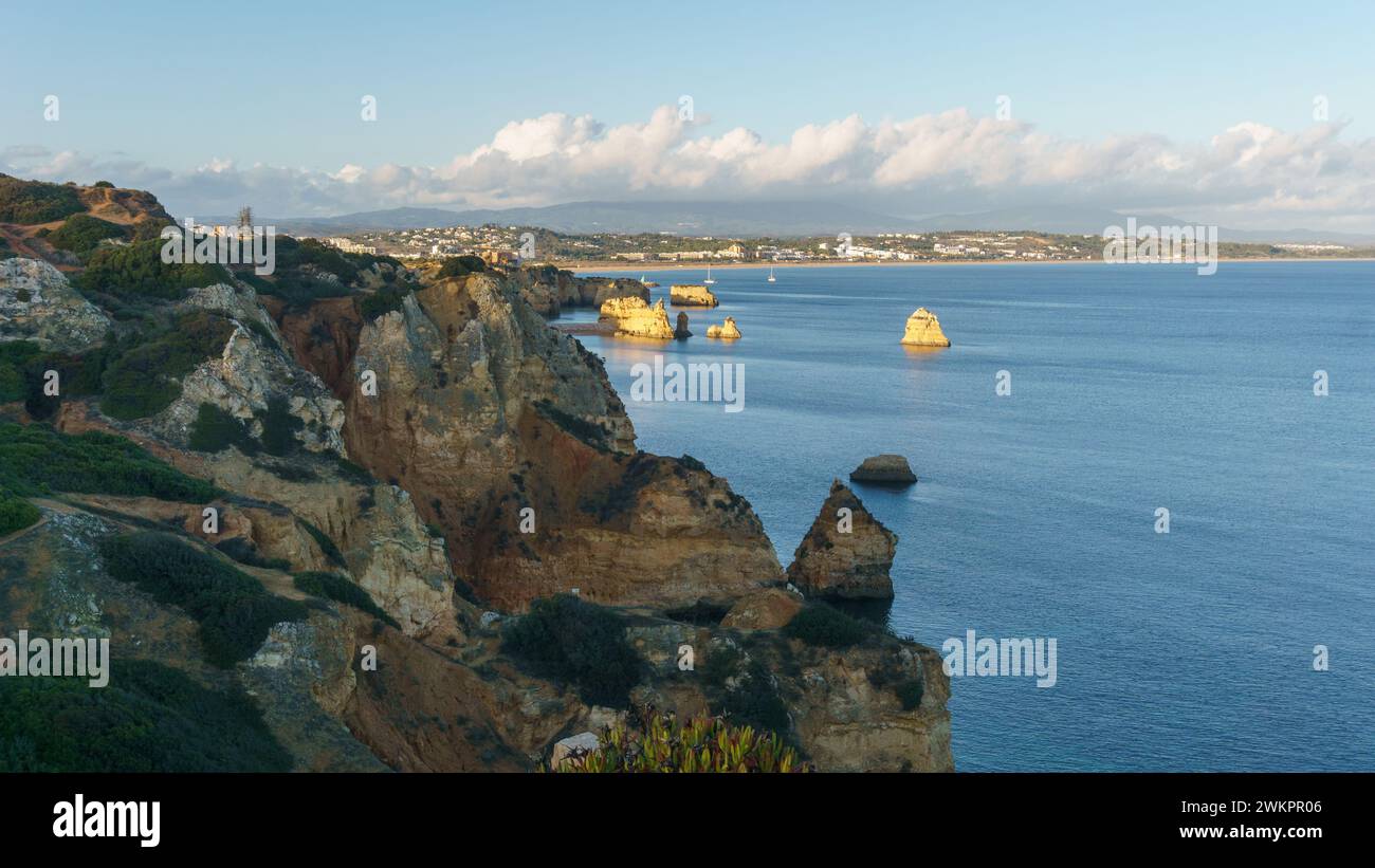 View of cliff in golden sunlight at the atlantic coast line at the town ...