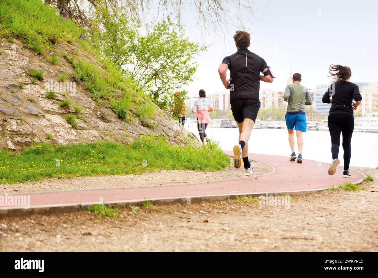 People running on a treadmill in the park Stock Photo - Alamy