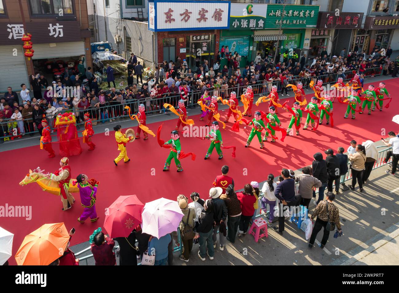 Folk actors perform on the street to welcome Lantern Festival in Ningbo ...