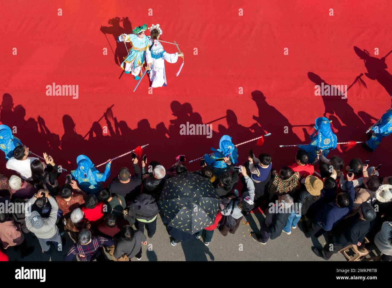 Folk actors perform on the street to welcome Lantern Festival in Ningbo ...