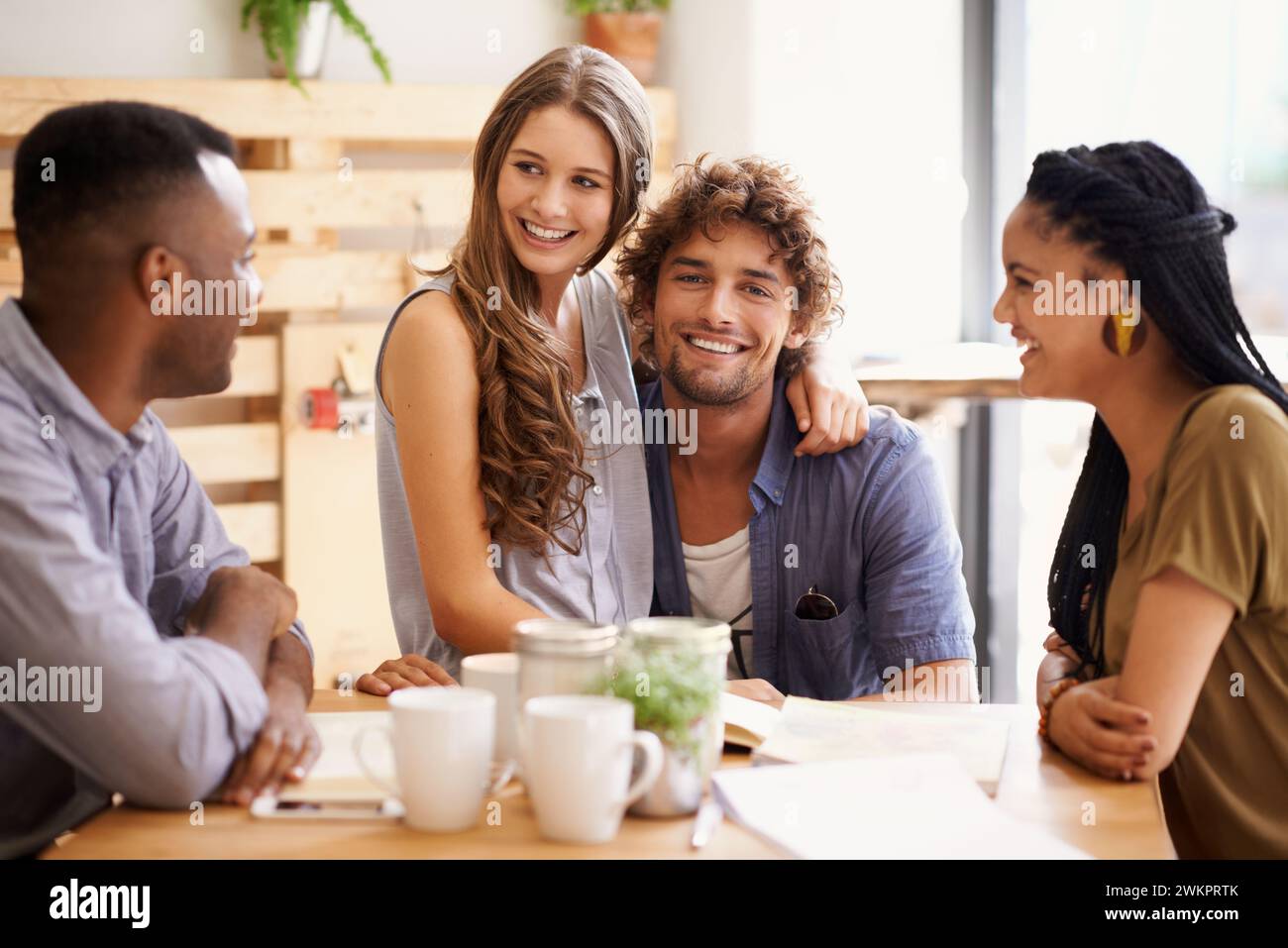 Conversation, laugh and university friends in restaurant together for ...