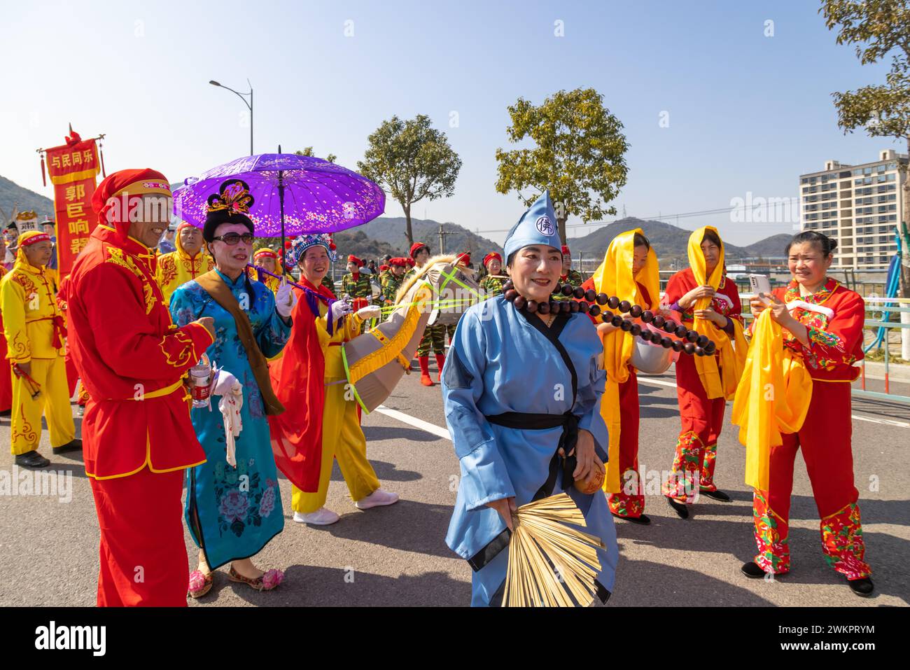 Folk actors perform on the street to welcome Lantern Festival in Ningbo ...