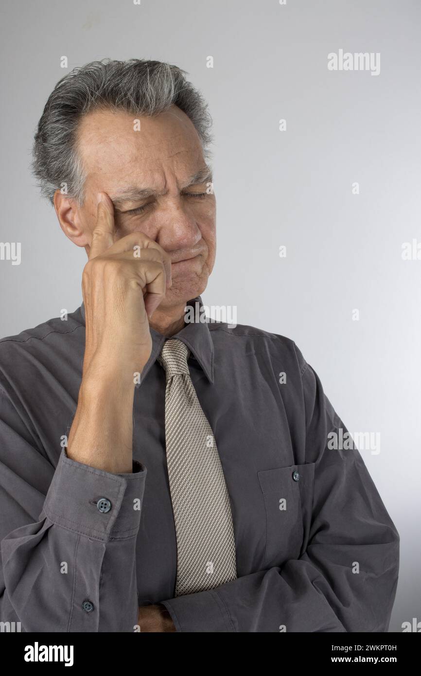 An elderly man in deep thoughts Stock Photo - Alamy