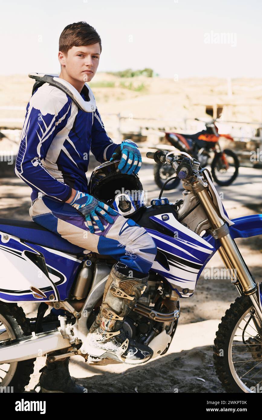 Motorbike, extreme sport and portrait for man on trail for competition ...