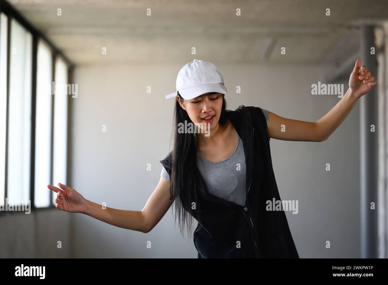 Young beautiful hip hop dancer dancing in an abandoned building ...