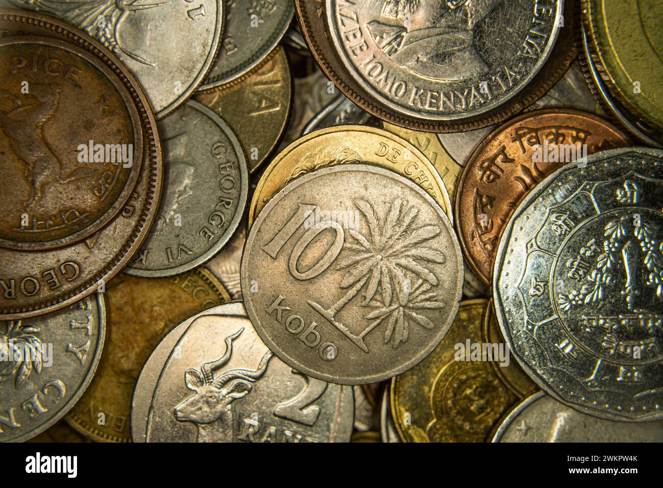 A stack of assorted coins with a 10 kobo coin at the center Stock Photo ...