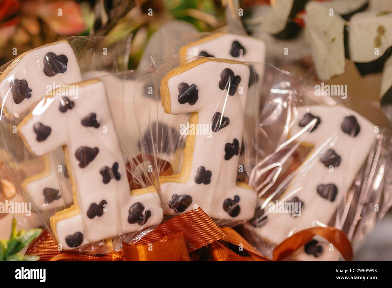 A close-up of a number one-shaped cake for a first birthday celebration ...