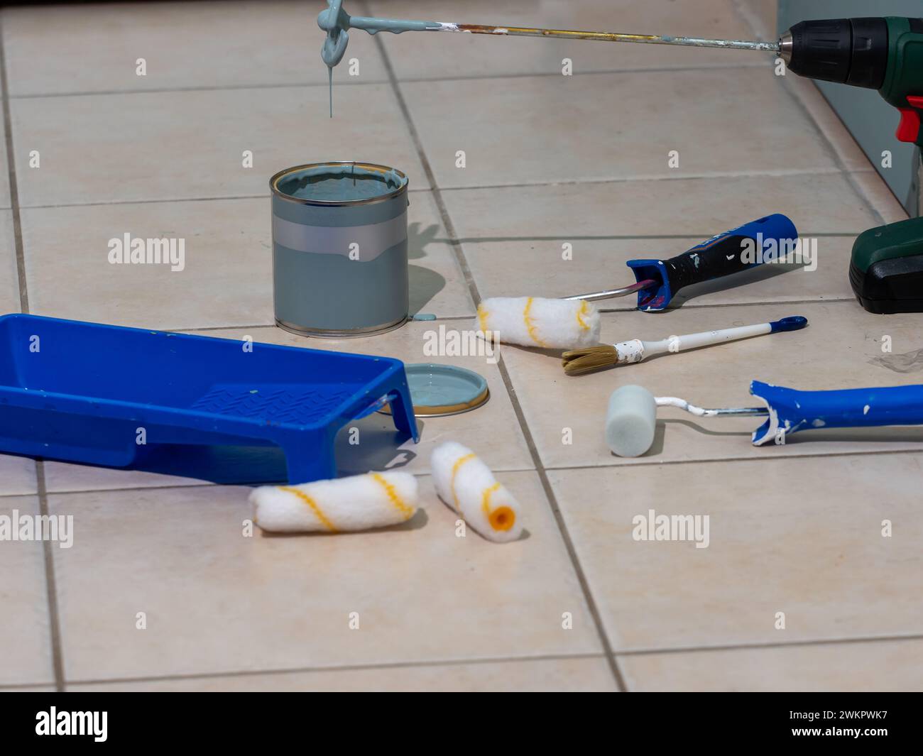 painting tools, brush, rollers, paint in a container, preparatory work ...