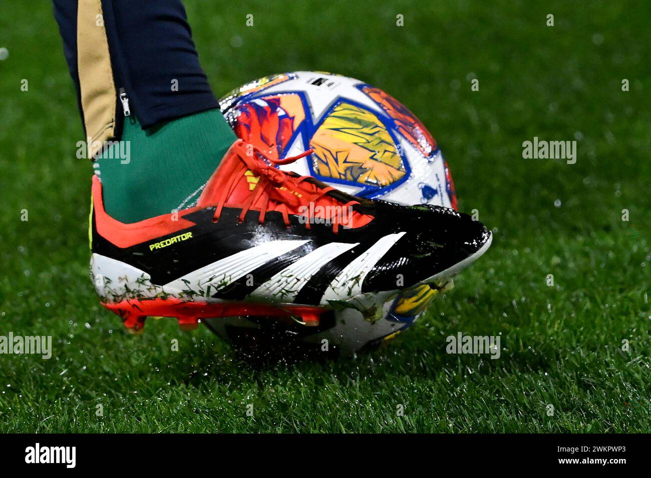 A coach wearing Adidas predator shoes, kicks the ball during the ...
