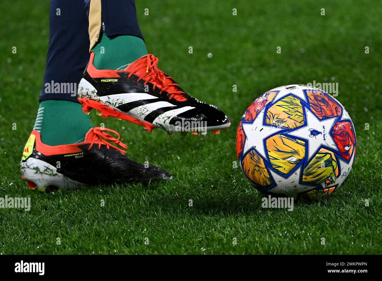 A coach wearing Adidas predator shoes, kicks the ball during the ...