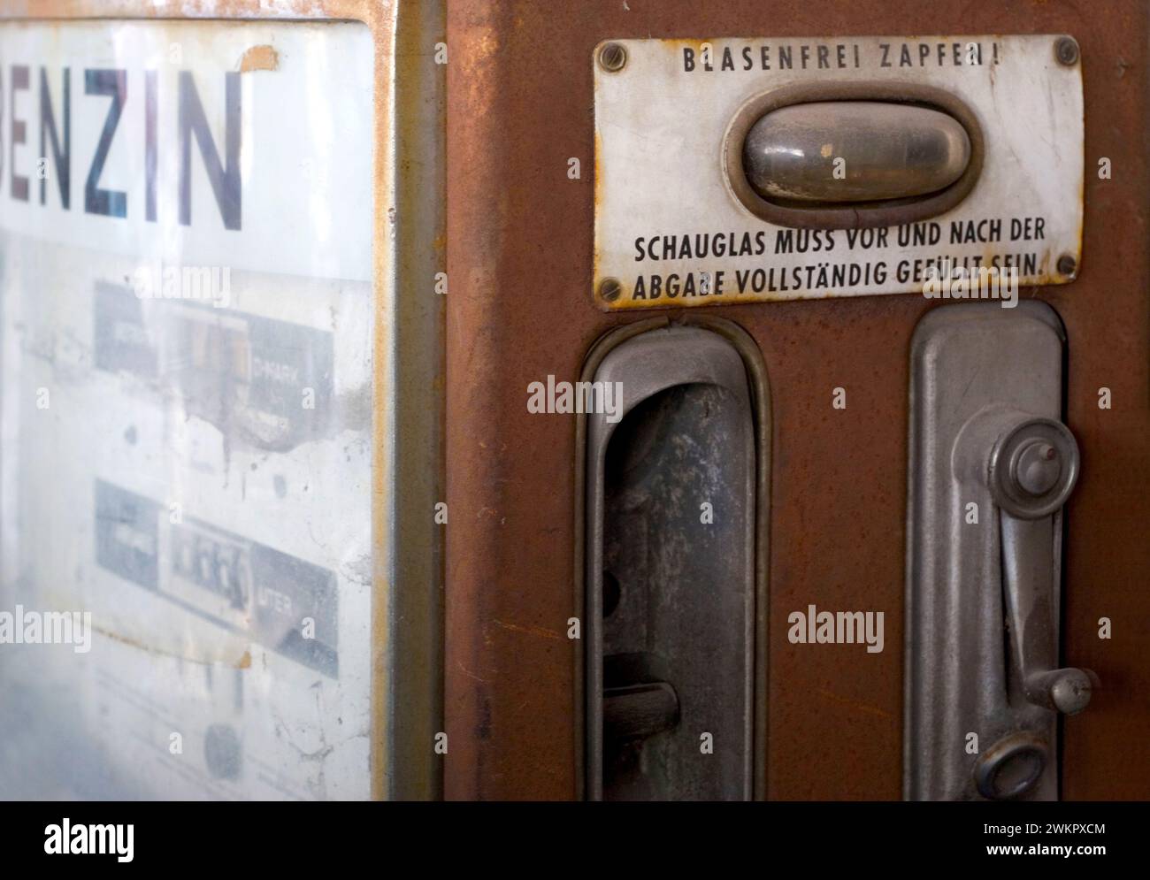 old rusty german petroleum pump, inscription in german, Benzin ...