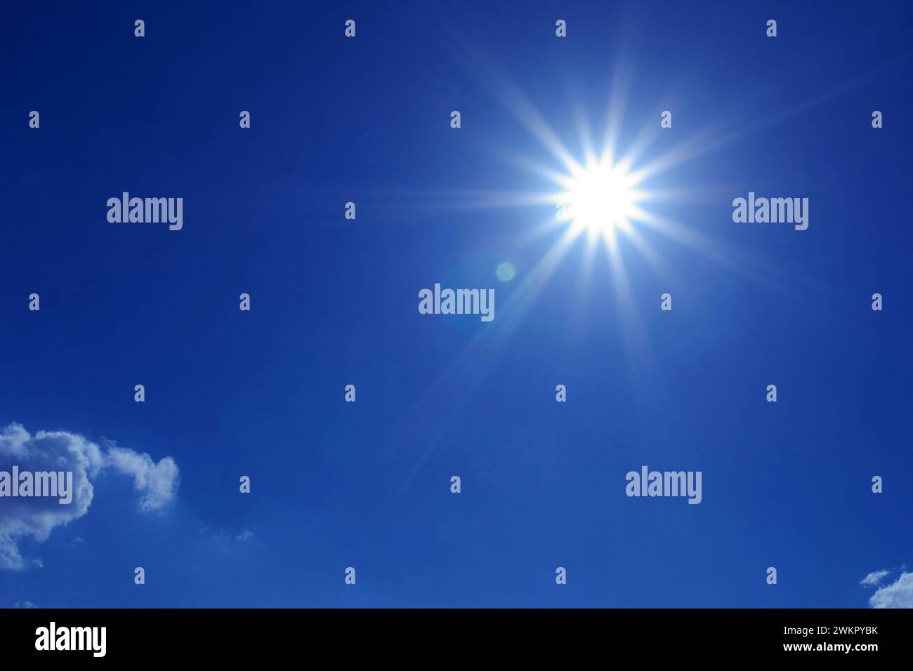 sun in blue sky Stock Photo - Alamy