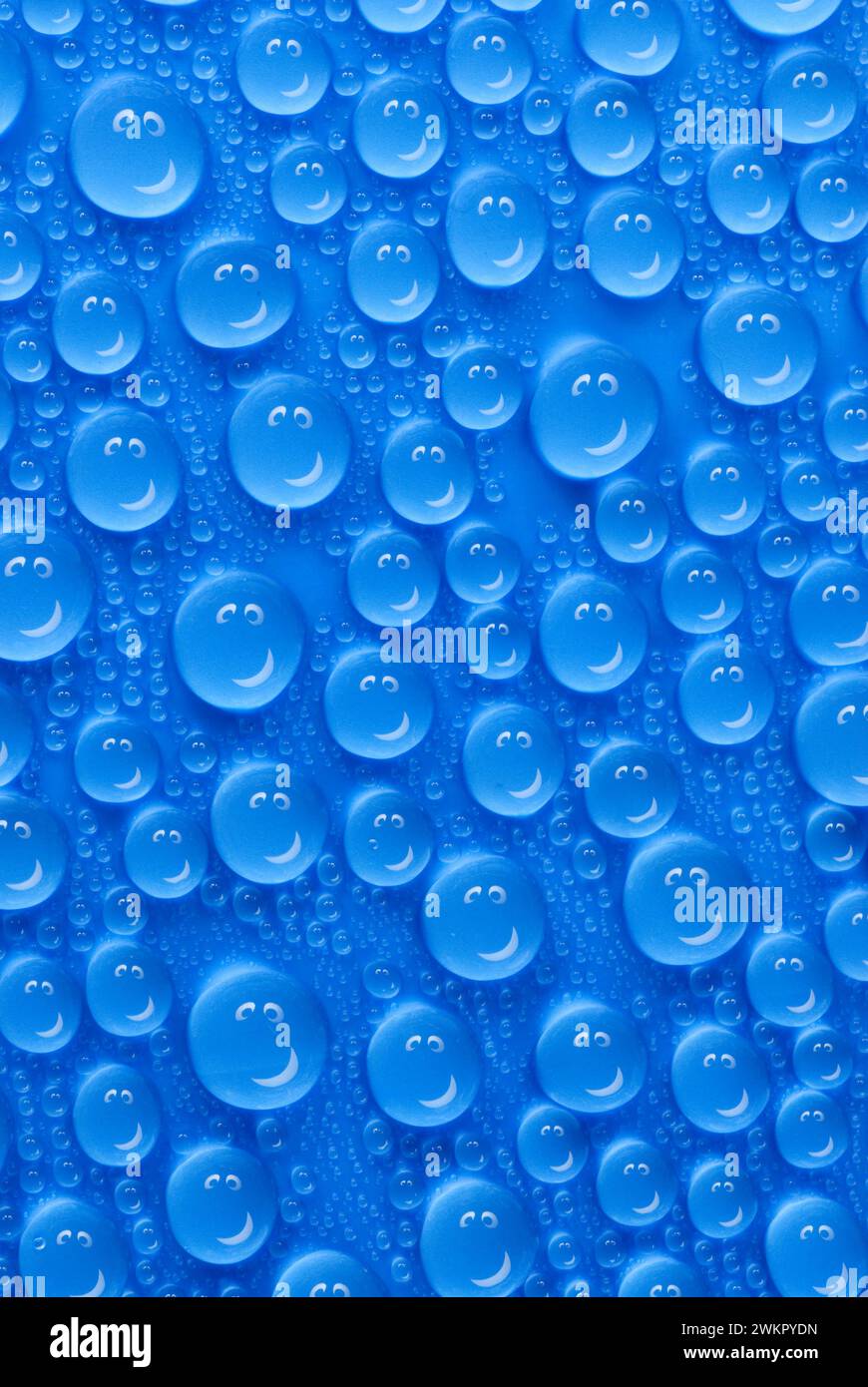 many water drops on a blue surface, a smiley face is reflected in every ...