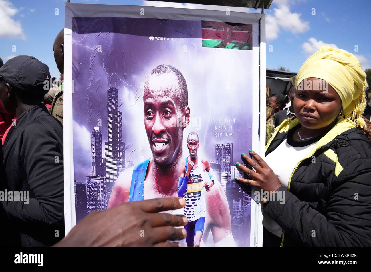 A woman displays a portrait of Kenyan athlete Kelvin Kiptum's ahead of ...