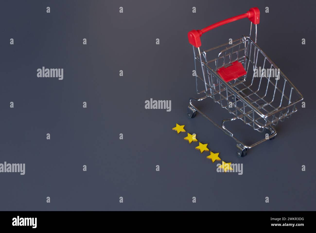 Shopping cart and five stars rating. Copy space. Online shopping review ...