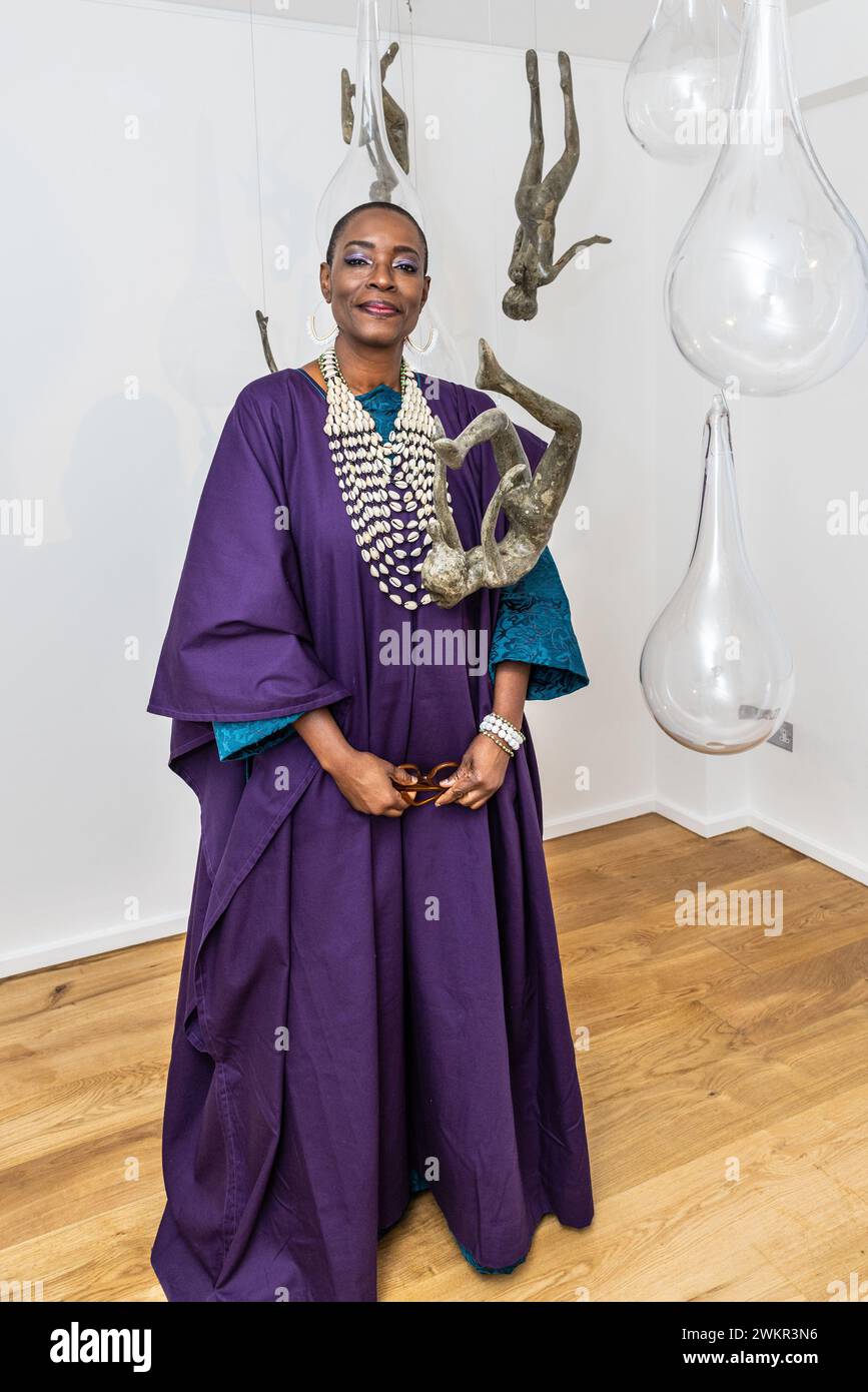 London, UK. 21st Feb, 2024. Artist Peju Alatise with her work 'We Came ...