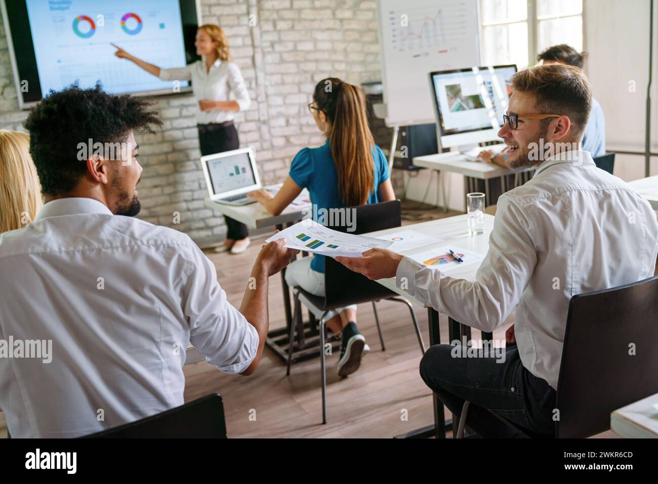 Successful business woman ceo executive manager showing to colleagues ...
