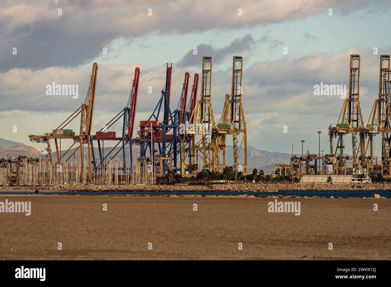 A bustling industrial port shows the activity of trade with container ...